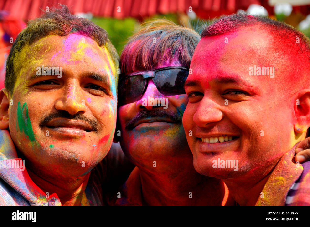 Three Indians playing holi A colorful festival of India Stock Photo - Alamy