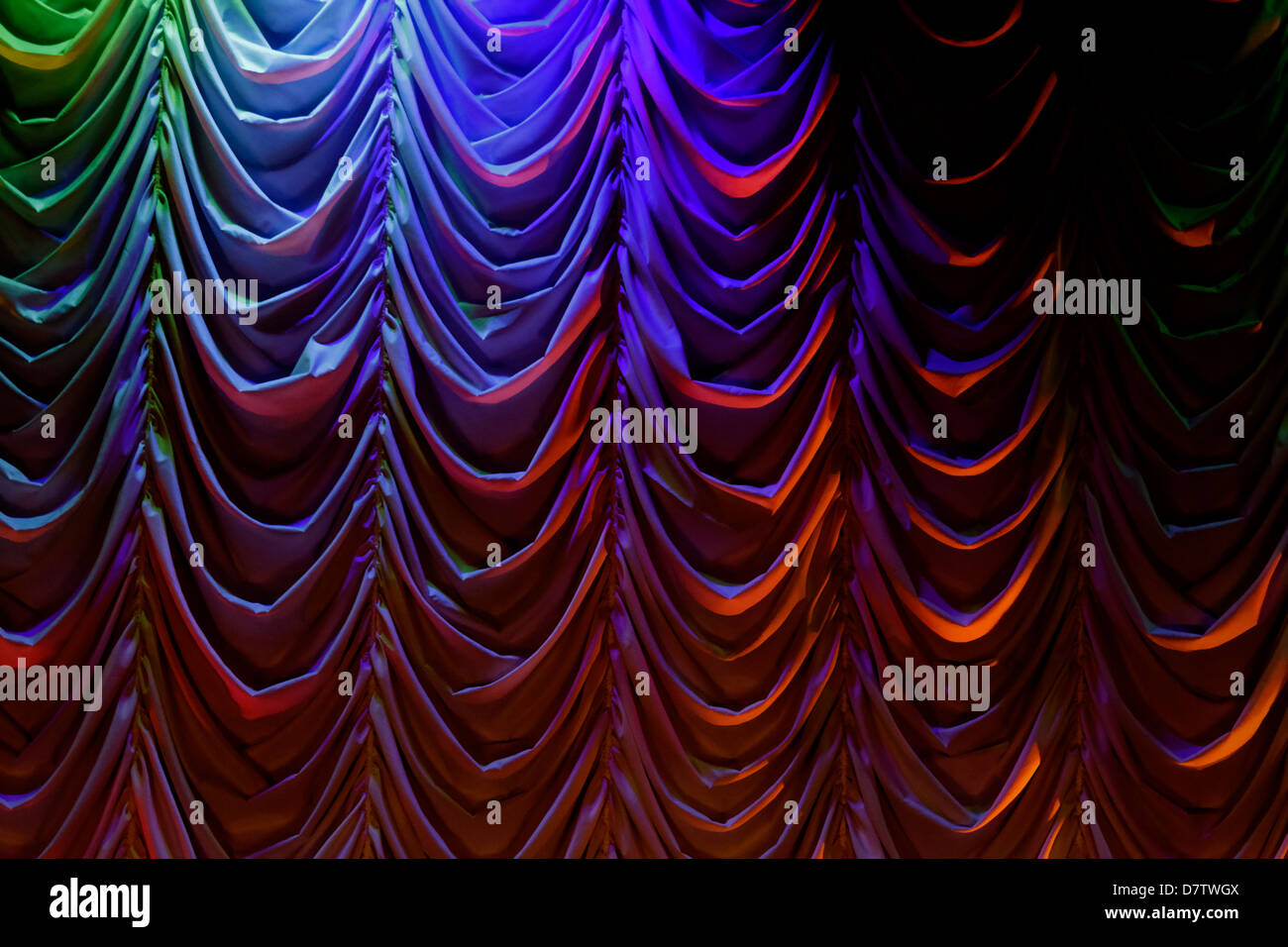 macabre theater curtain with pleats with multicolored lights Stock ...