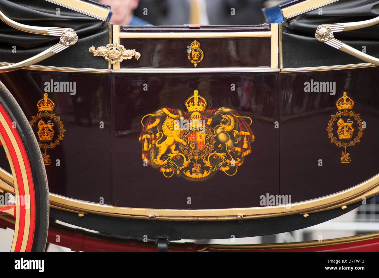 Open carriage emblazoned with the Royal coat of arms travelling to the ...