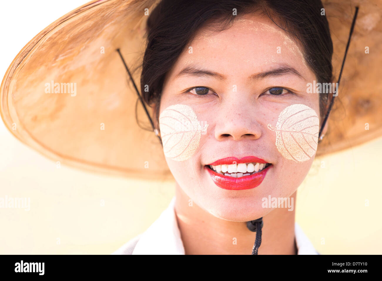 Backlit portrait of local woman wearing traditional clothing, near ...