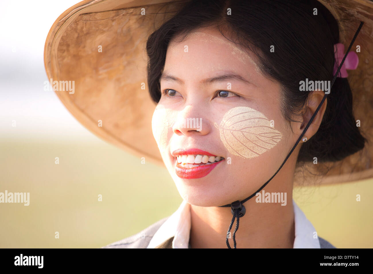 Backlit portrait of local woman wearing traditional clothing, near ...