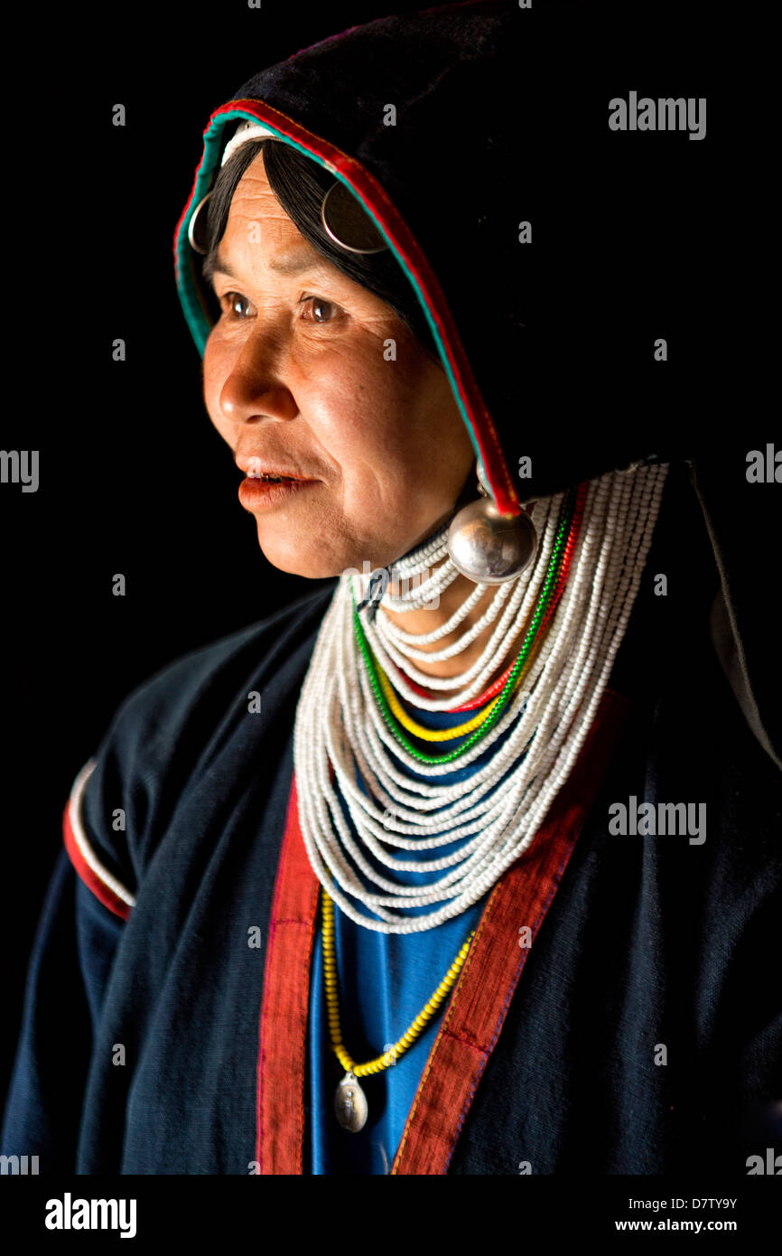 Woman of the Akha tribe in traditional dress, in a hill village near ...