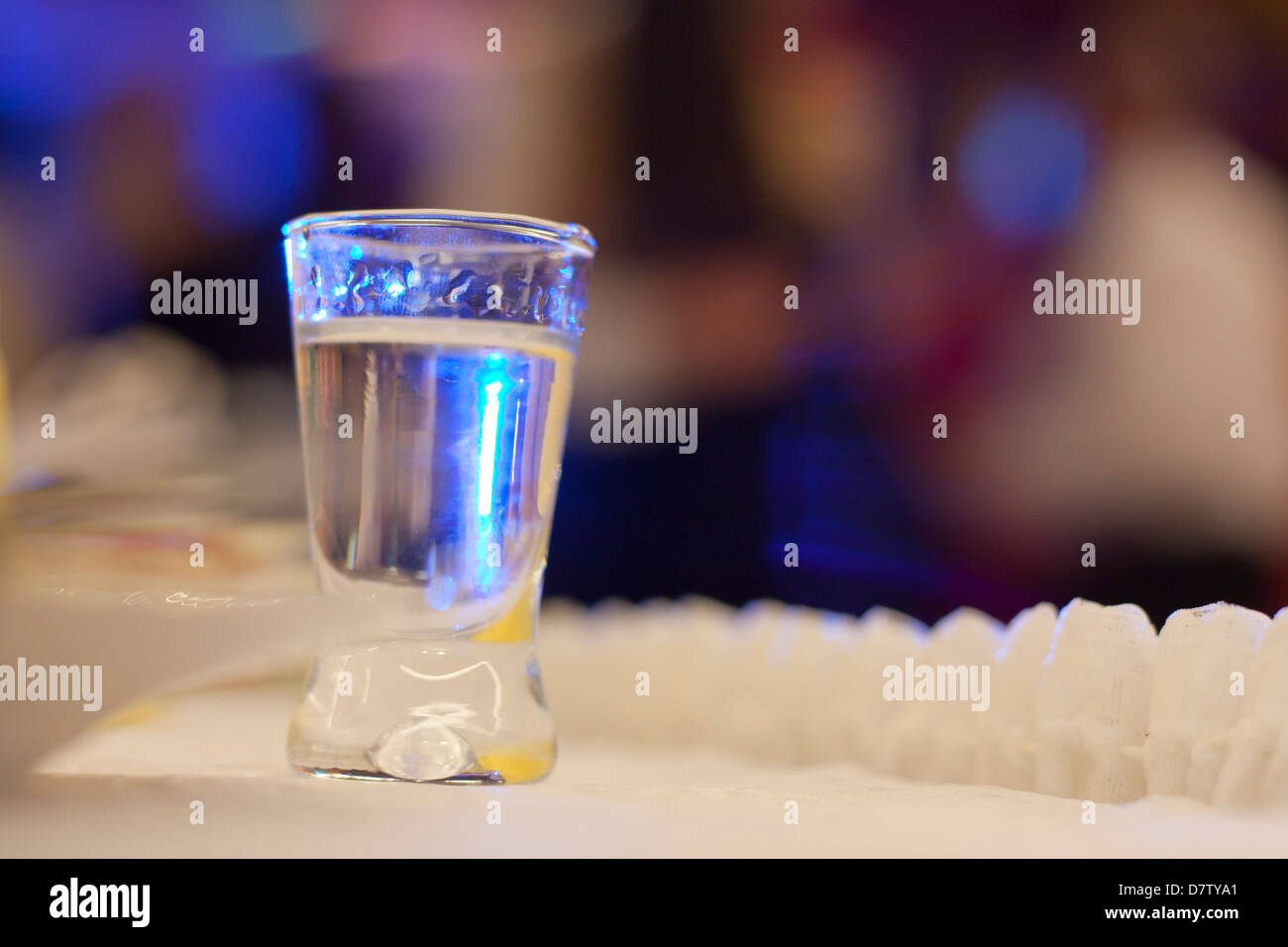 Glass of vodka on the table in restaurant closeup Stock Photo - Alamy