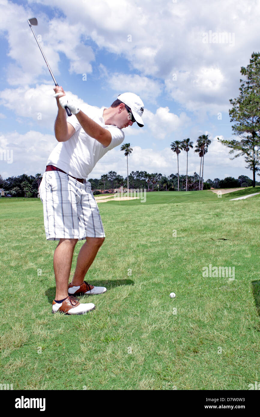 Young man on the golf course Stock Photo - Alamy