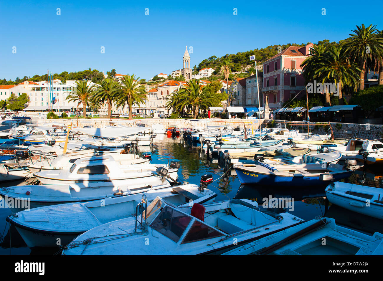 Hvar town centre, boats in Hvar harbour and church bell tower, Hvar ...