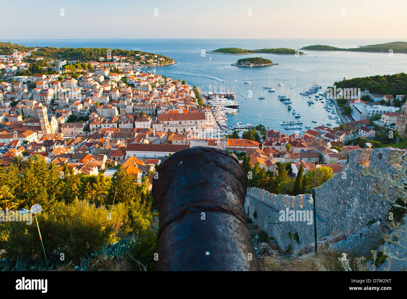 Hvar Fortress cannon and Hvar Town at sunset taken from the Spanish ...