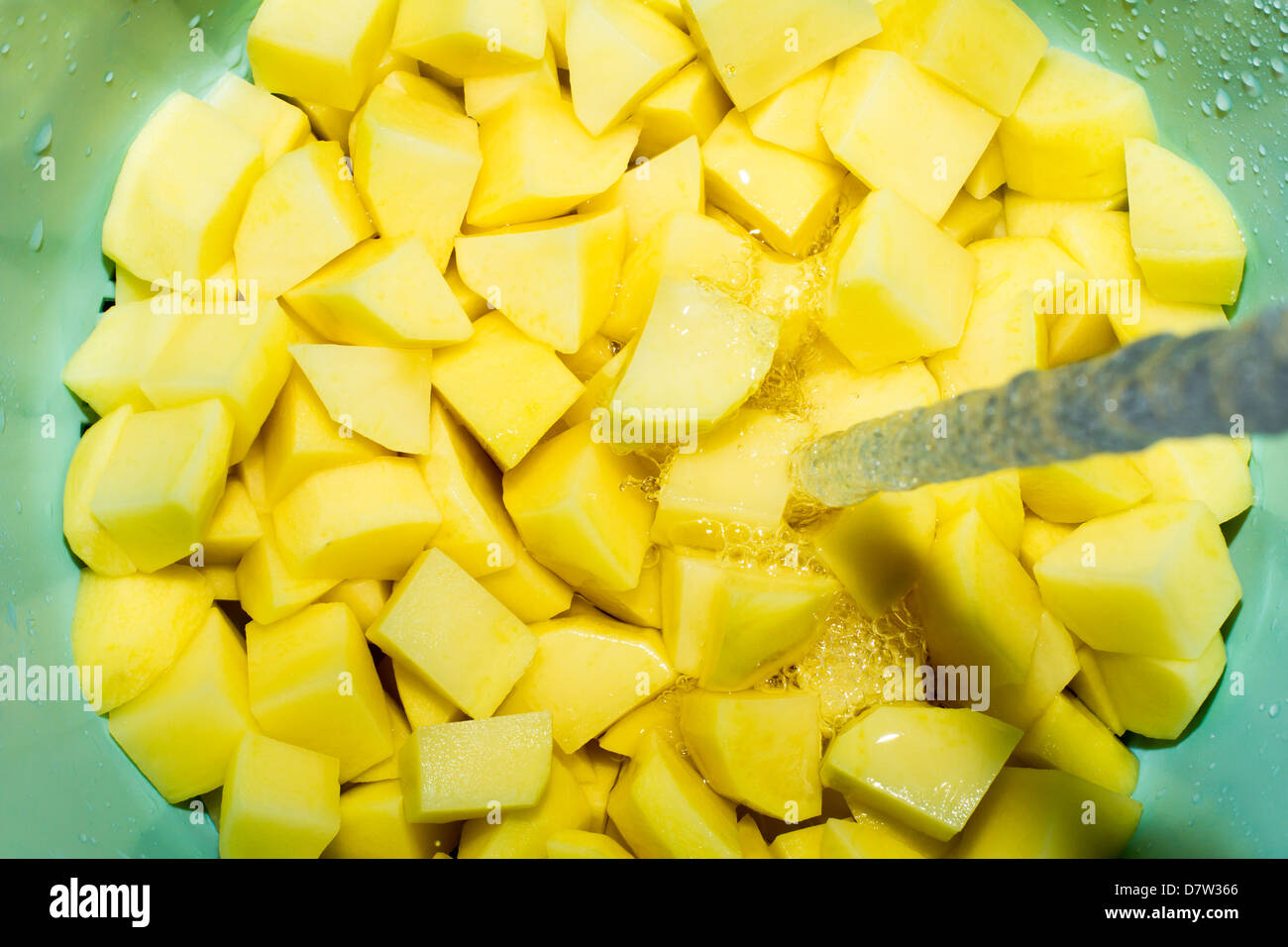 Cut potatoes being washed Stock Photo - Alamy