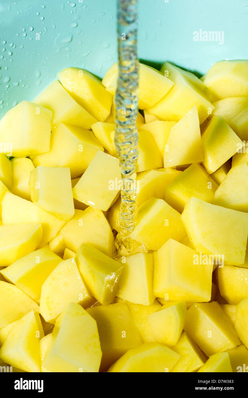 Cut potatoes being washed Stock Photo - Alamy