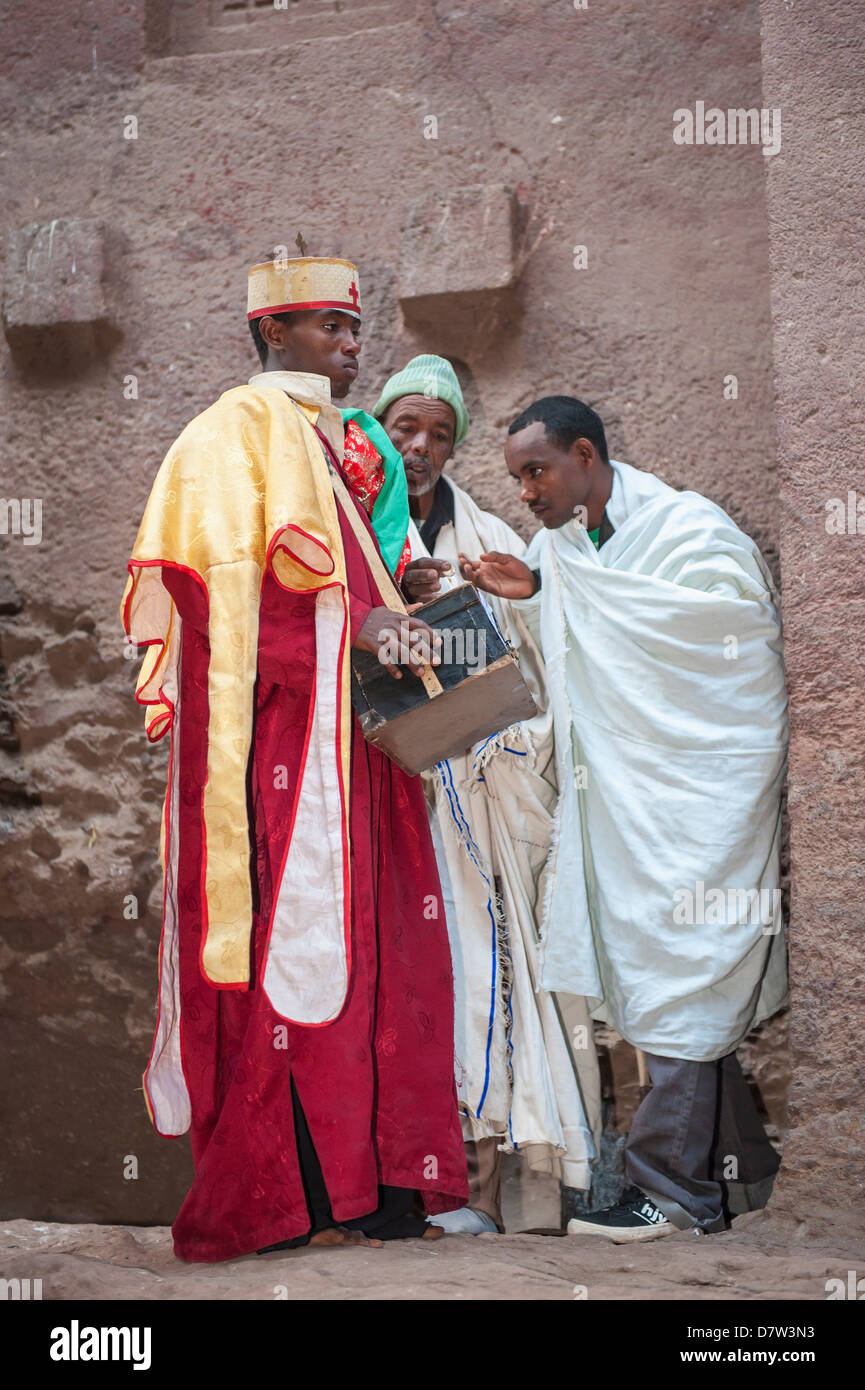 Priest holding relics from the Bete Medhane Alem Church, Lalibela ...
