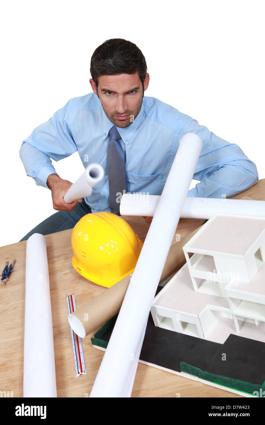 Angry architect sat at his desk Stock Photo - Alamy