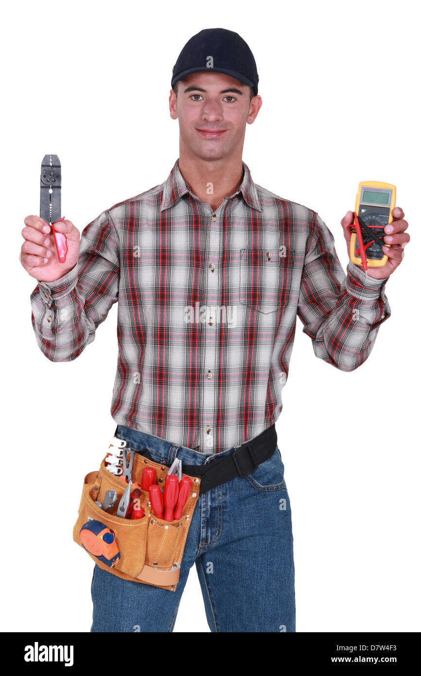 Man holding wire clipper and electrical current measure Stock Photo - Alamy