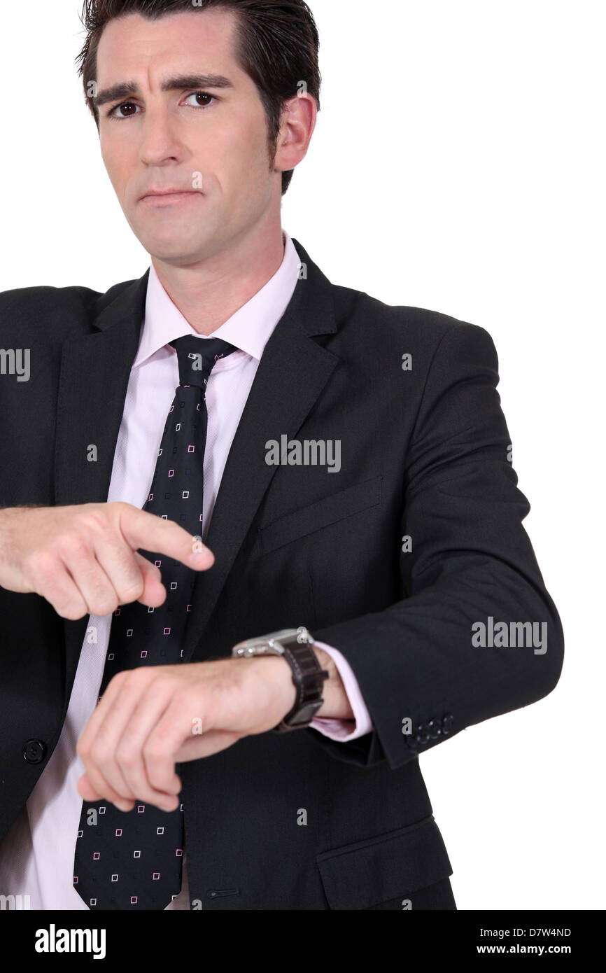 Angry boss pointing watch hi-res stock photography and images - Alamy