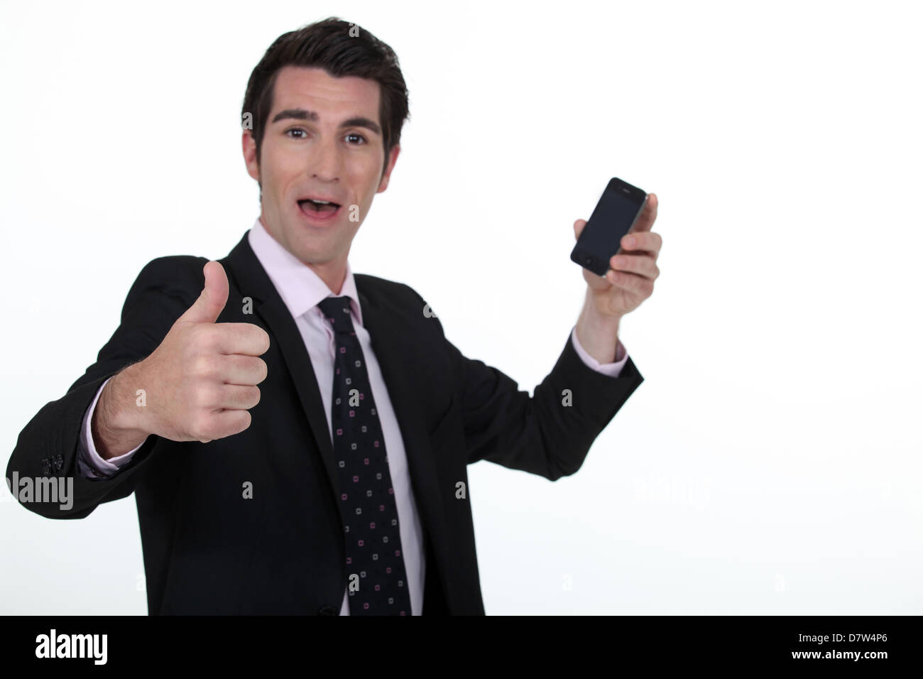 Businessman receiving good news Stock Photo - Alamy