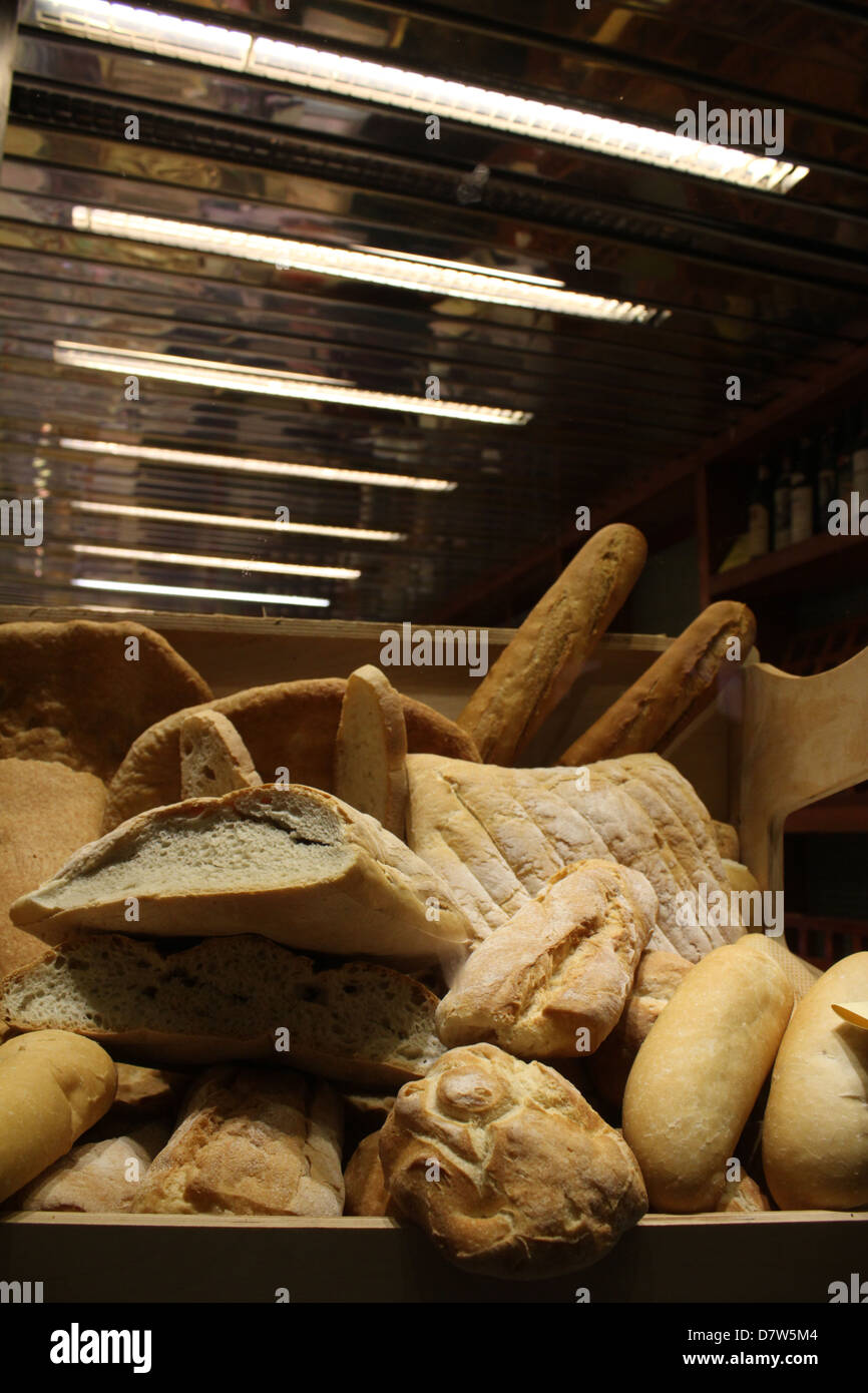 fresh bread on display in baker shop window at night in lucca tuscany ...