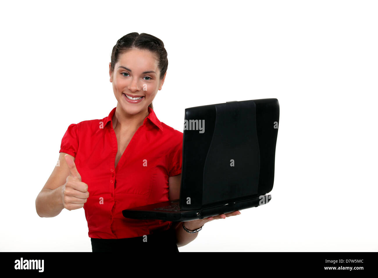 Woman giving the thumbs up to her laptop Stock Photo - Alamy