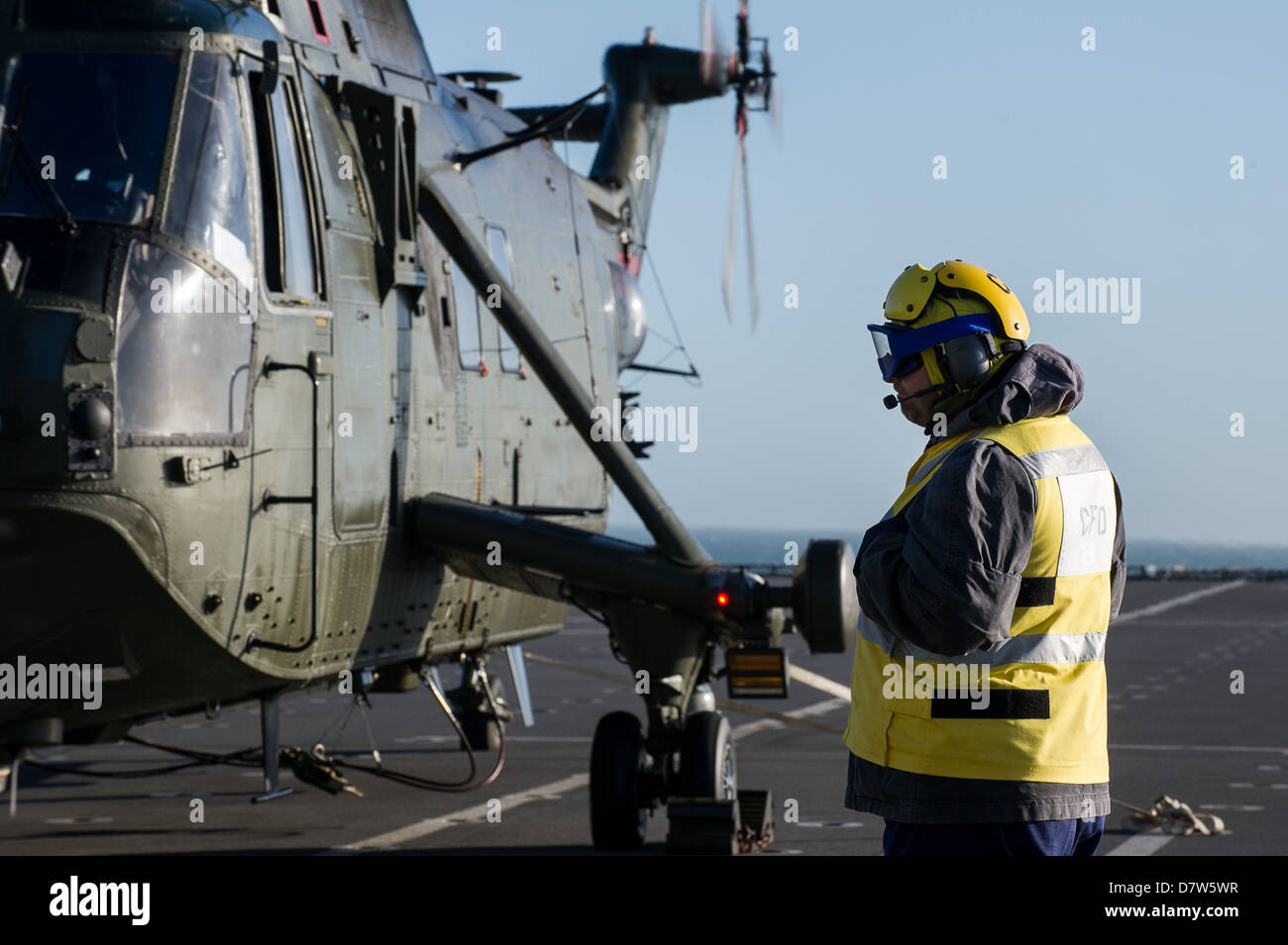 A Royal Navy Mk4 Sea King on the deck of HMS Bulwark preparing to take ...