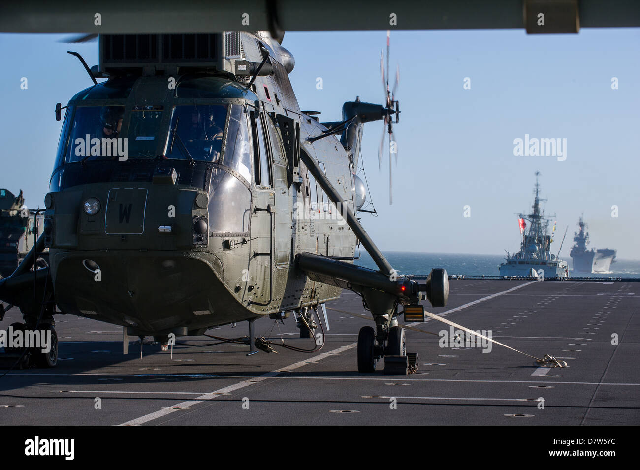 A Royal Navy Mk4 Sea King on the deck of HMS Bulwark preparing to take ...