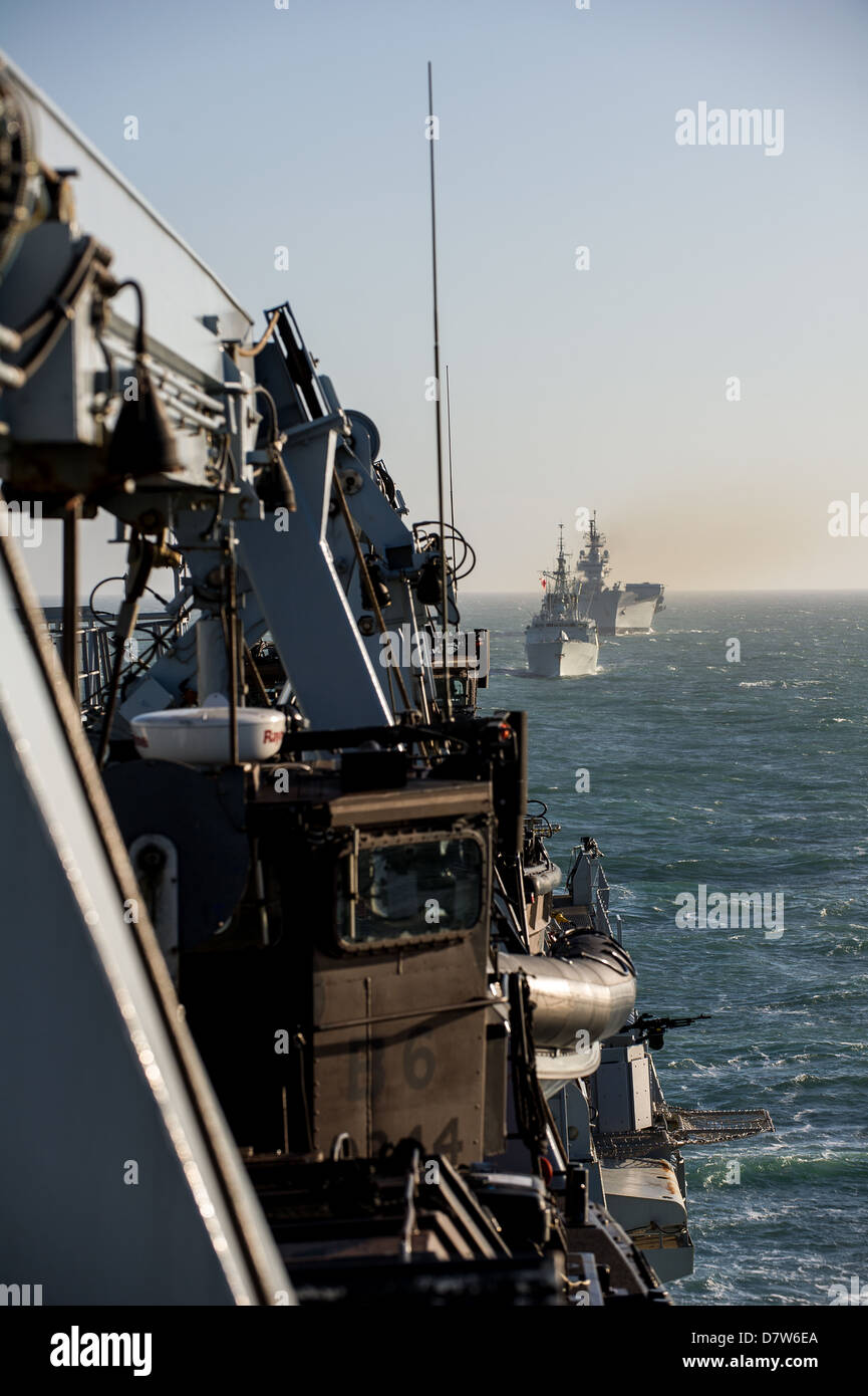 Destroyer HMCS Iroquois leading Assault Carrier HMS Illustrious at sea ...