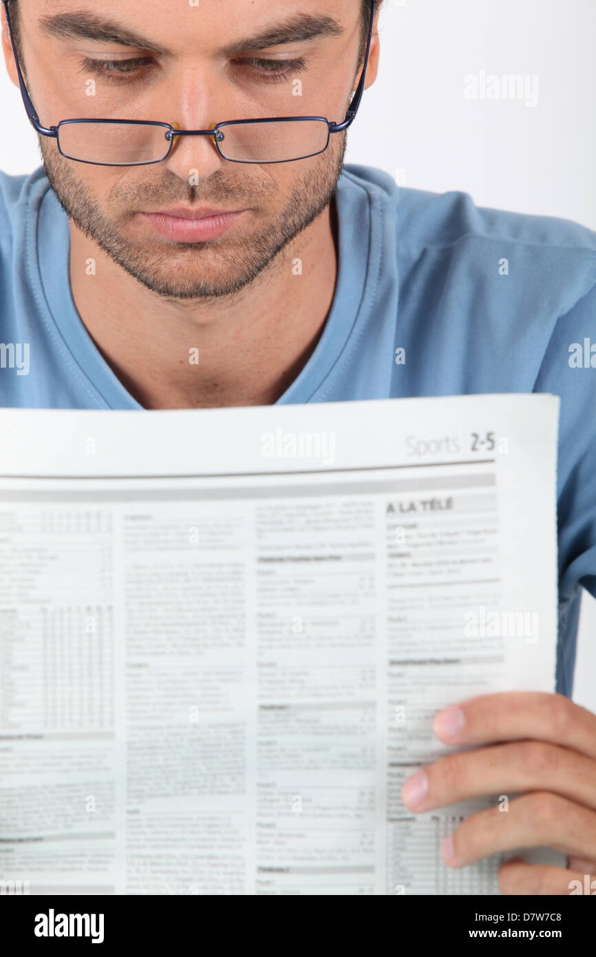 Man reading the newspaper Stock Photo - Alamy