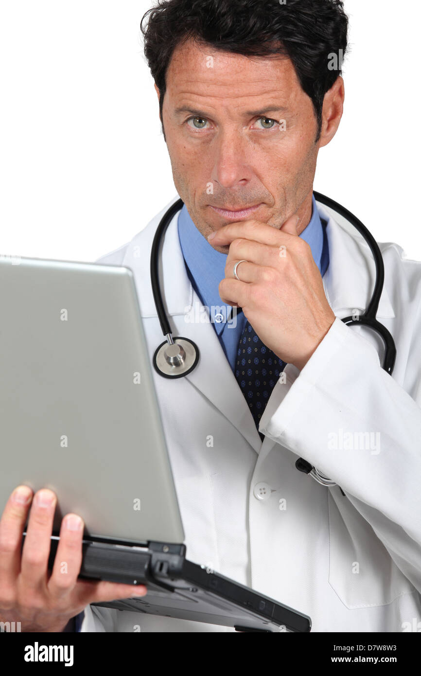 Serious thinking doctor working hi-res stock photography and images - Alamy