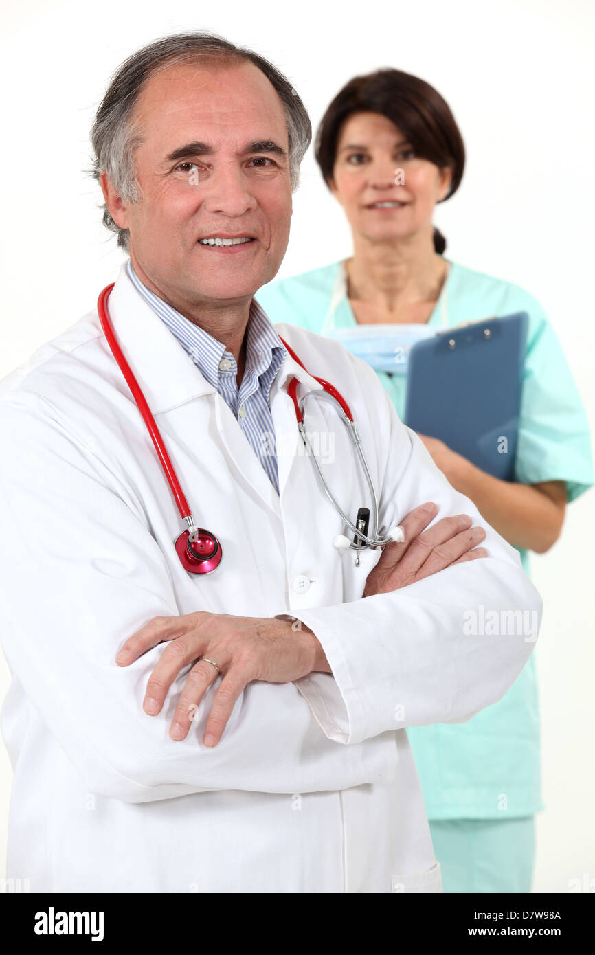 A practitioner and his nurse Stock Photo - Alamy