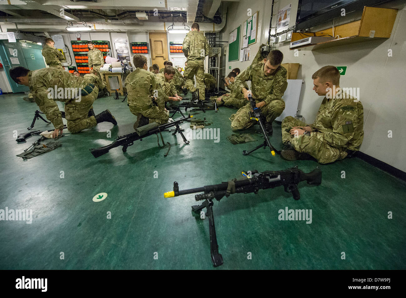 Royal Marines cleaning weapons onboard HMS Bulwark Stock Photo - Alamy