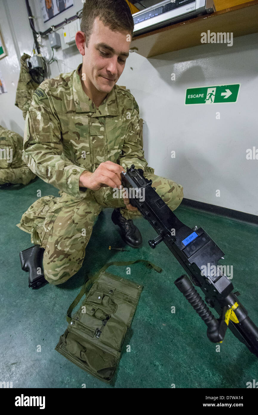 Royal Marines cleaning weapons onboard HMS Bulwark Stock Photo - Alamy