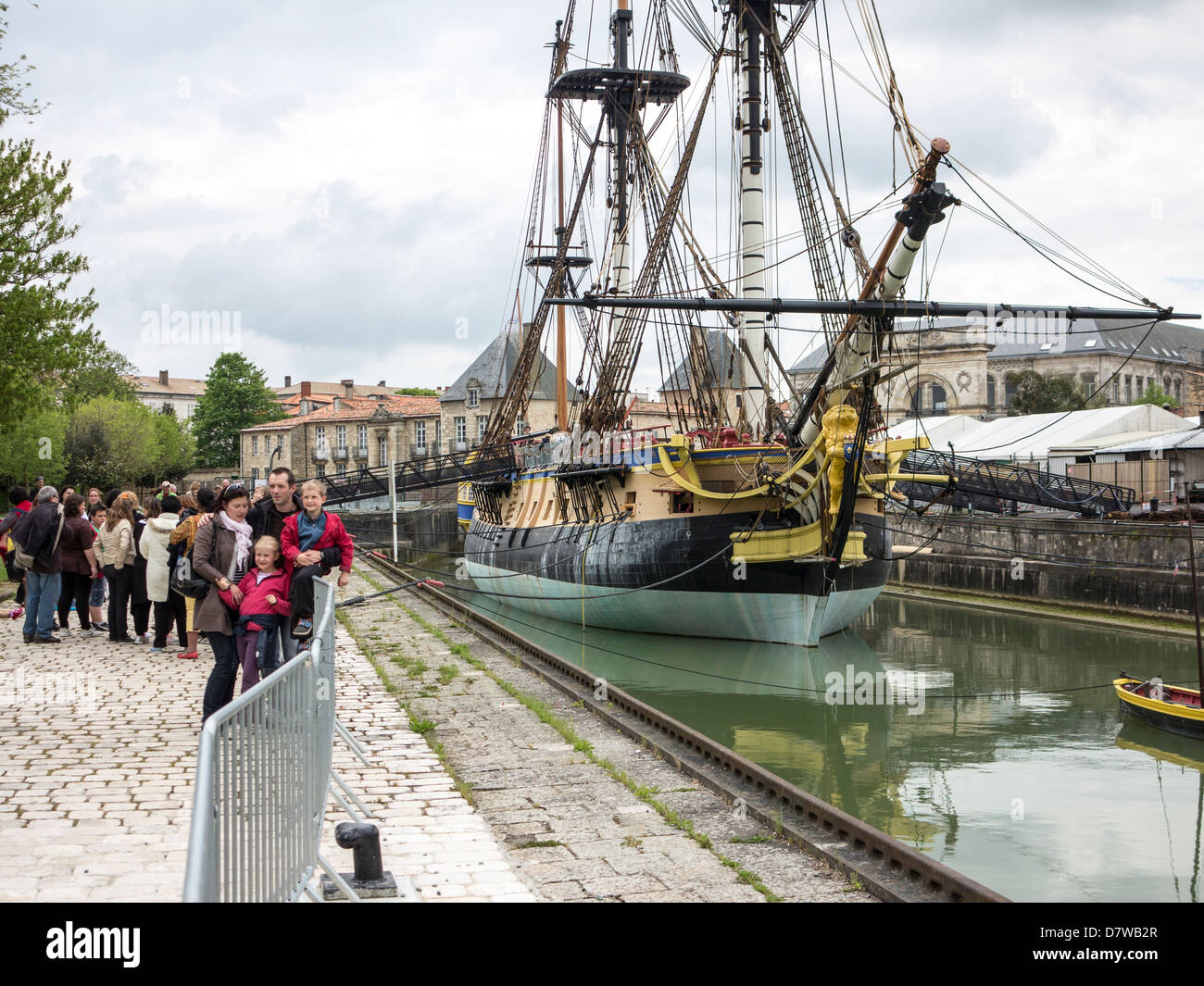 Visitors look at the replica of the 18th century French frigate ...