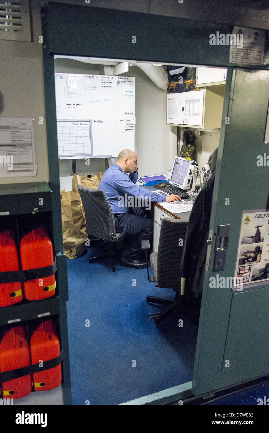 An typical office with a serviceman at work onboard Royal Navy Assault ...