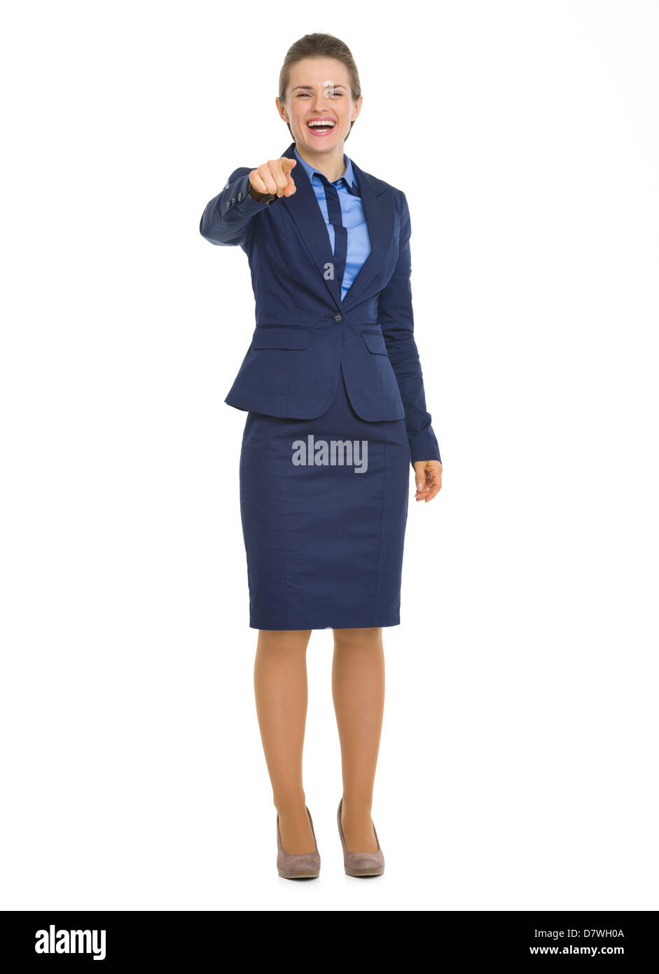 Full length portrait of smiling business woman pointing in camera Stock ...