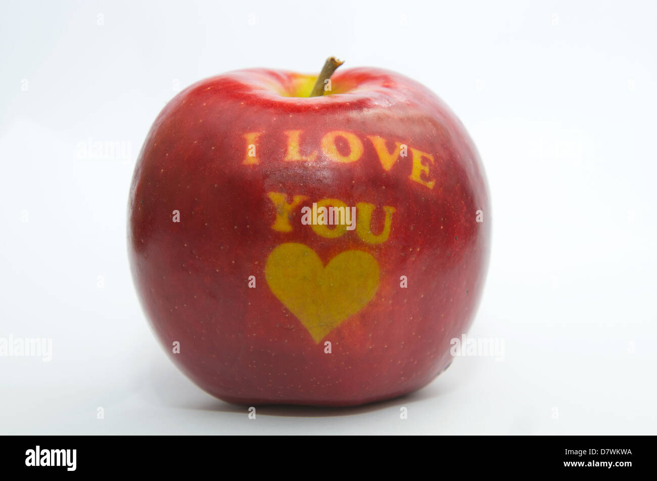 An apple with the inscription about love Stock Photo - Alamy