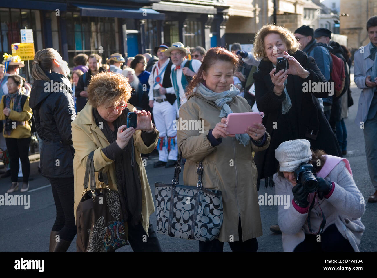Tourist UK taking photograph of Morris Men using their ipad tablets ...