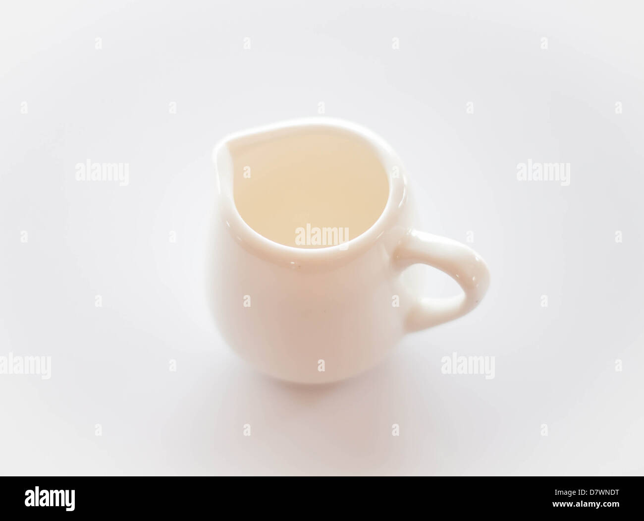 Empty white ceramic pitcher on clean table Stock Photo - Alamy