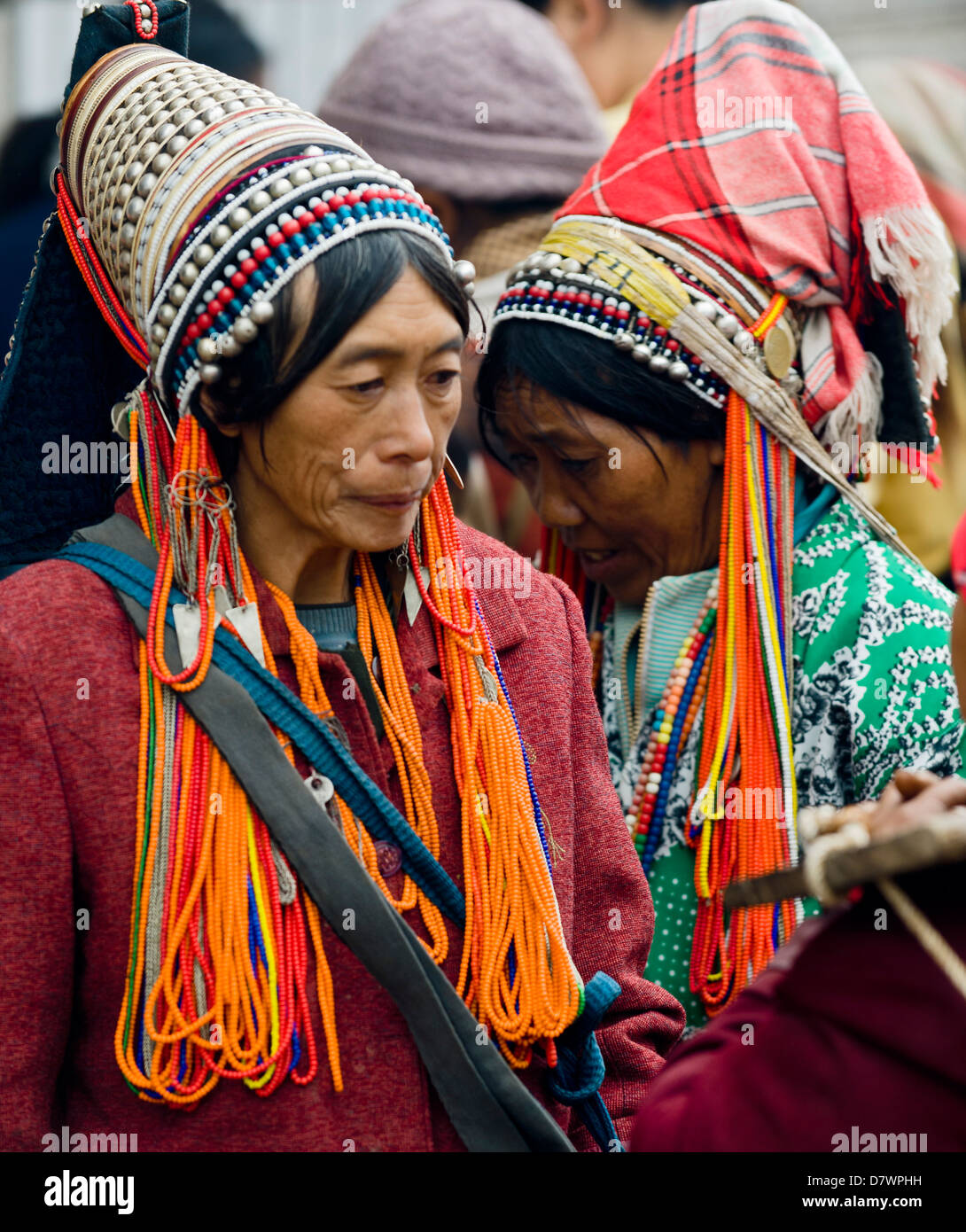 Akha women at Xiding weekly market, in the hills west of Menghai ...