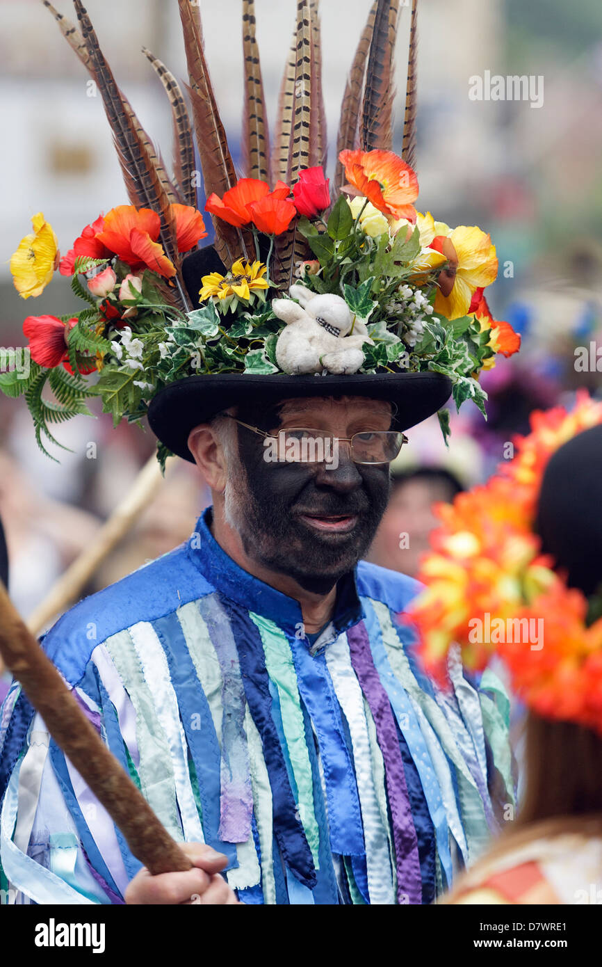 A Morris dancer wearing a colourful hat performs on the opening day of ...