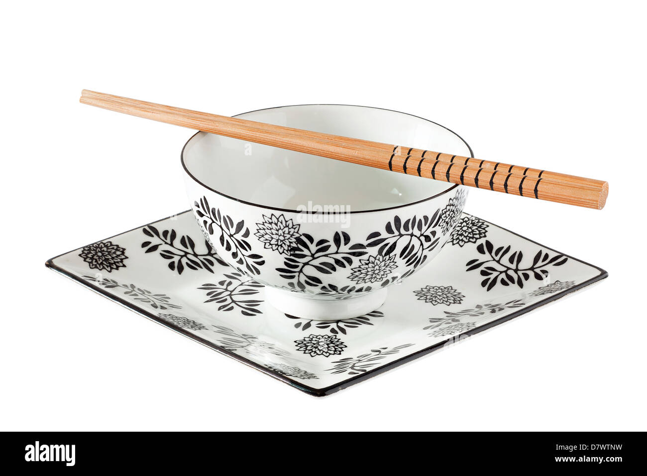 Asian place setting consisting of a plate, a bowl and chopsticks ...