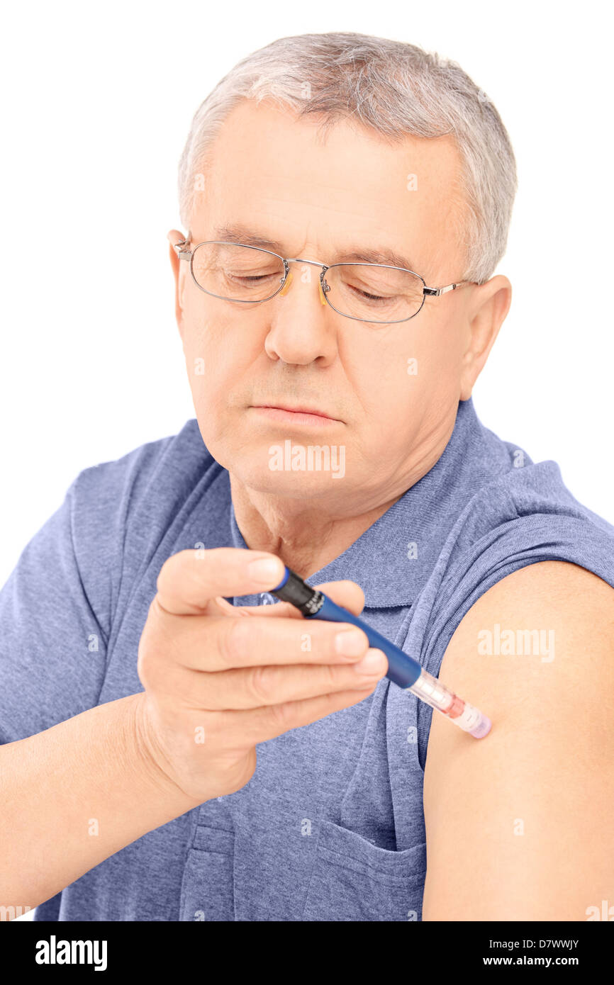 Middle aged man injecting insulin in his arm, isolated on white ...