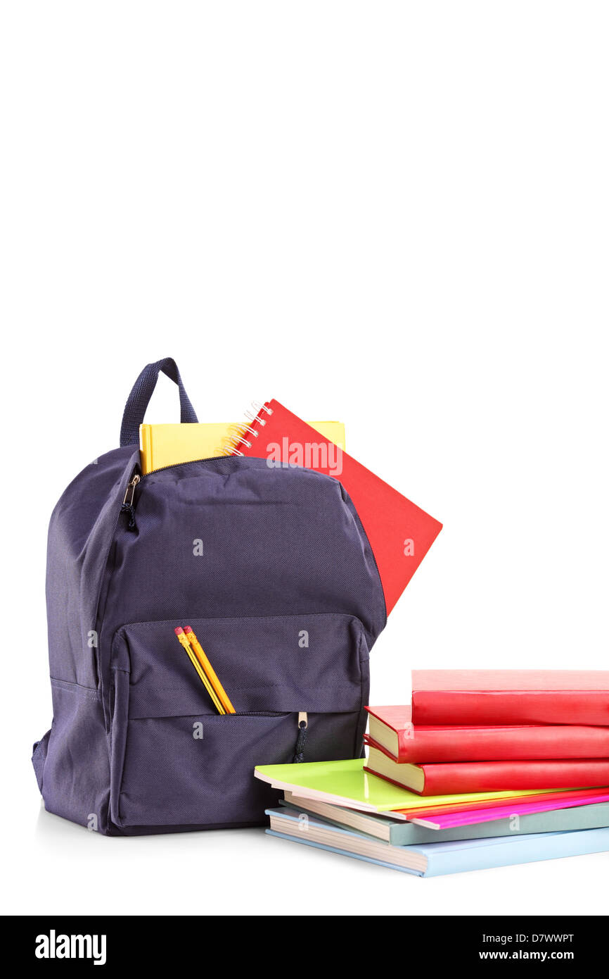 Studio shot of a school backpack with books and notebooks, isolated on ...