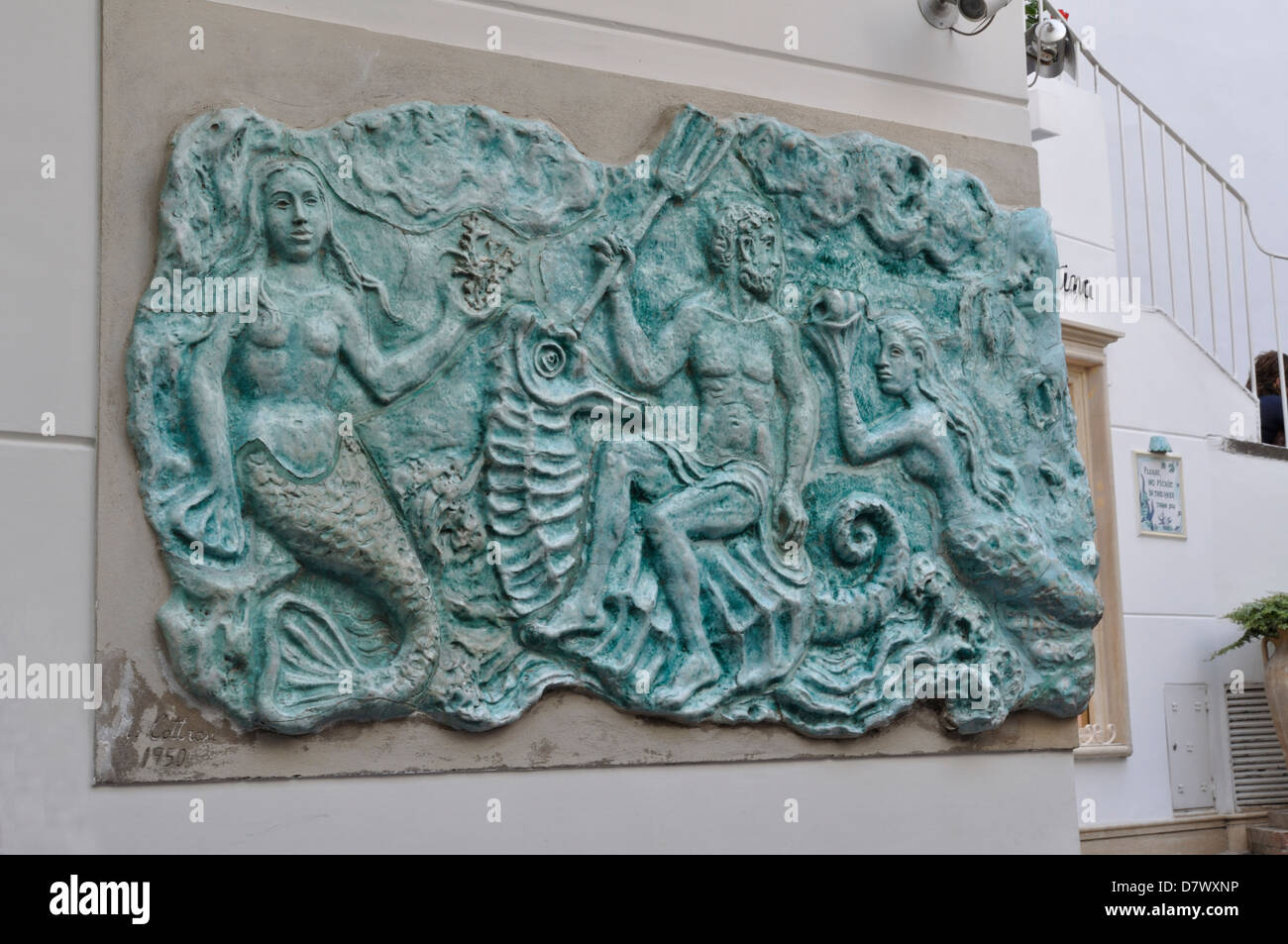 A ceramic faience by Domenico Gentile on the side of a building in ...