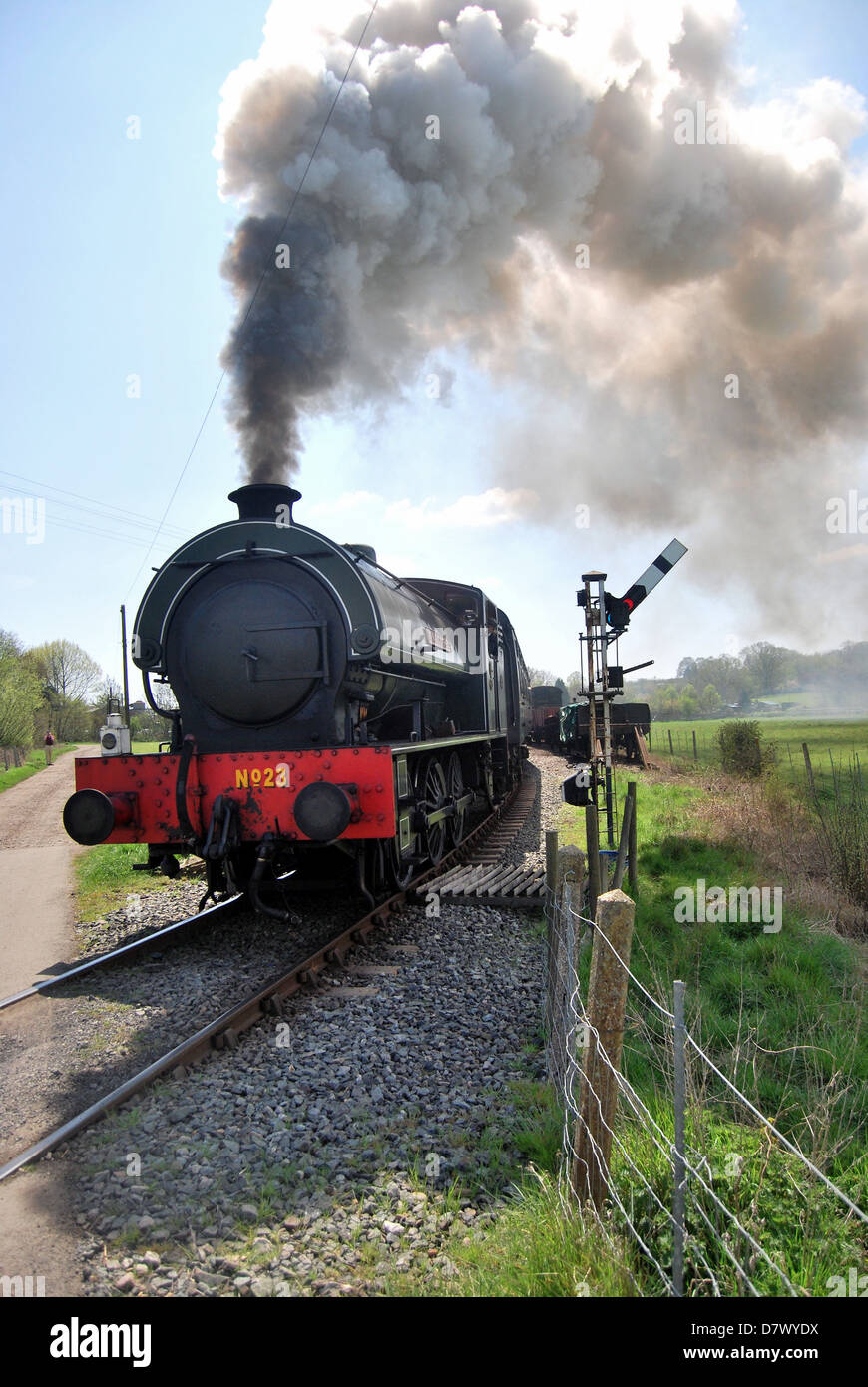 A steam train makes its way along through the Kent Countryside on a ...