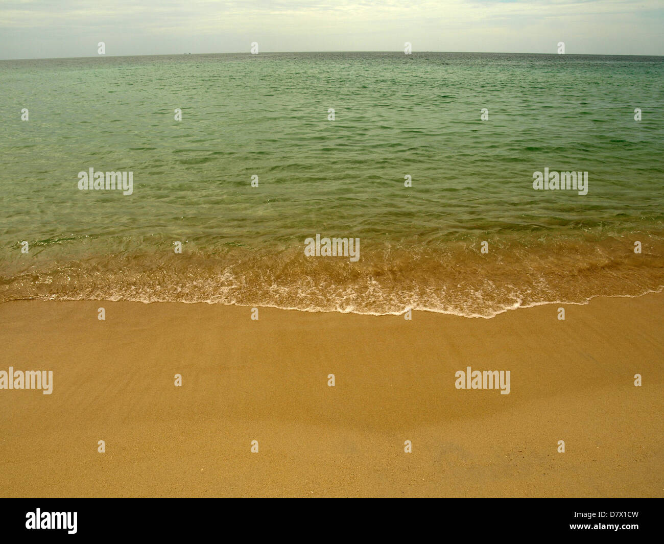 a quiet tide comes in during a calm morning Stock Photo - Alamy