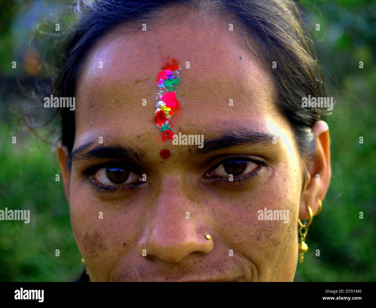 Tikka powder on the forehead of a Nepalese girl to celebrate Tihar in a ...