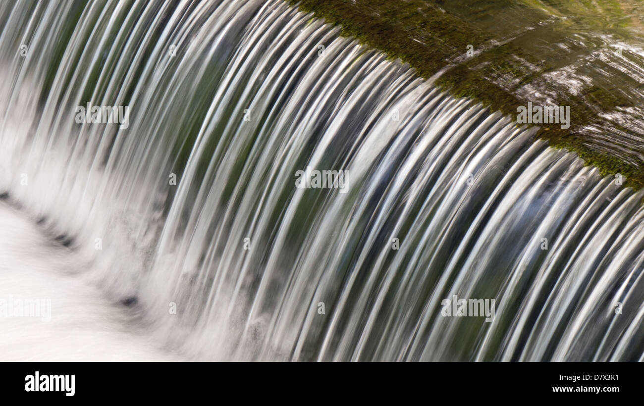 Water falling over a weir Stock Photo - Alamy