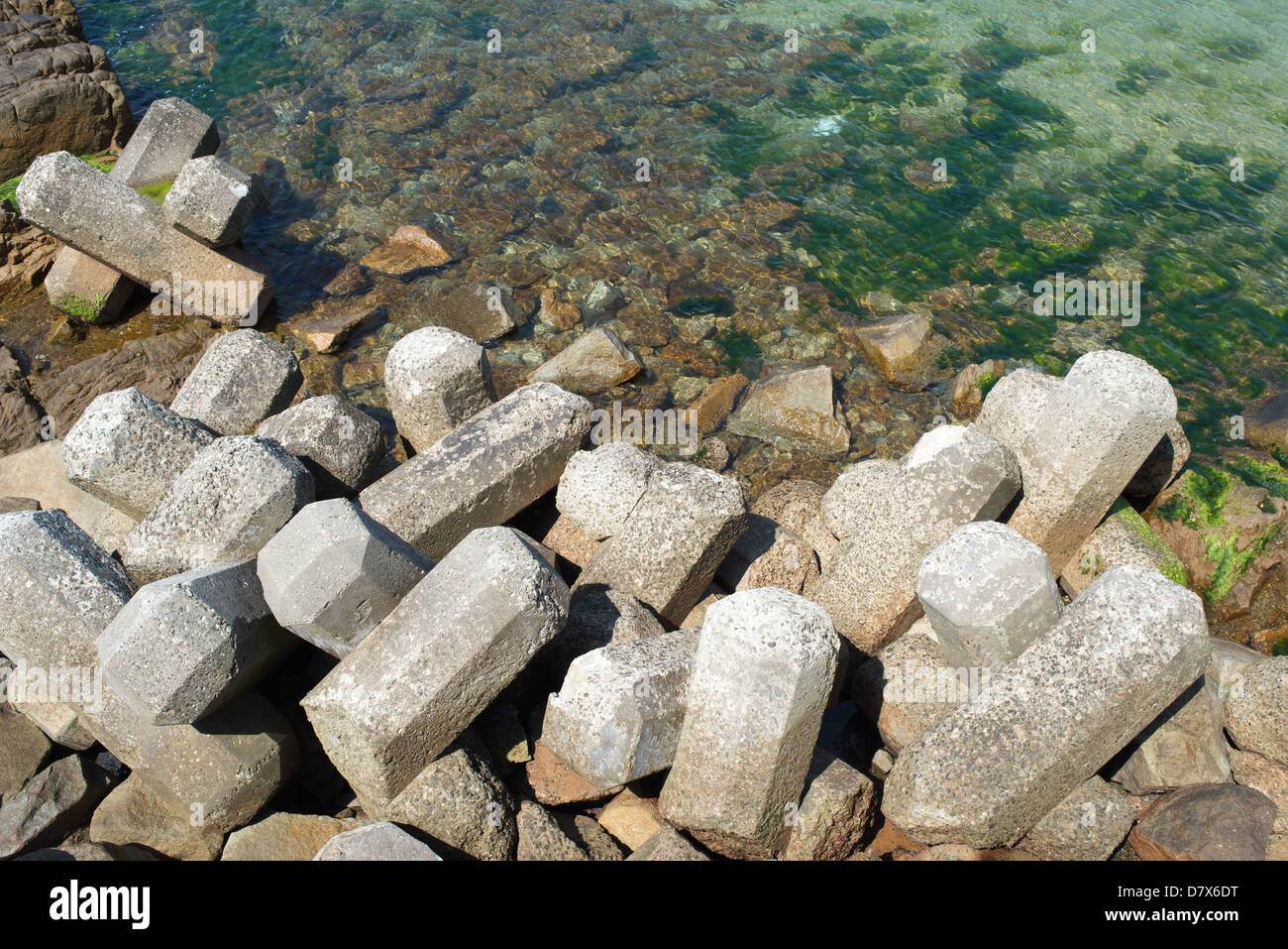 Breakwater with concrete blocks for protection of coast Stock Photo - Alamy