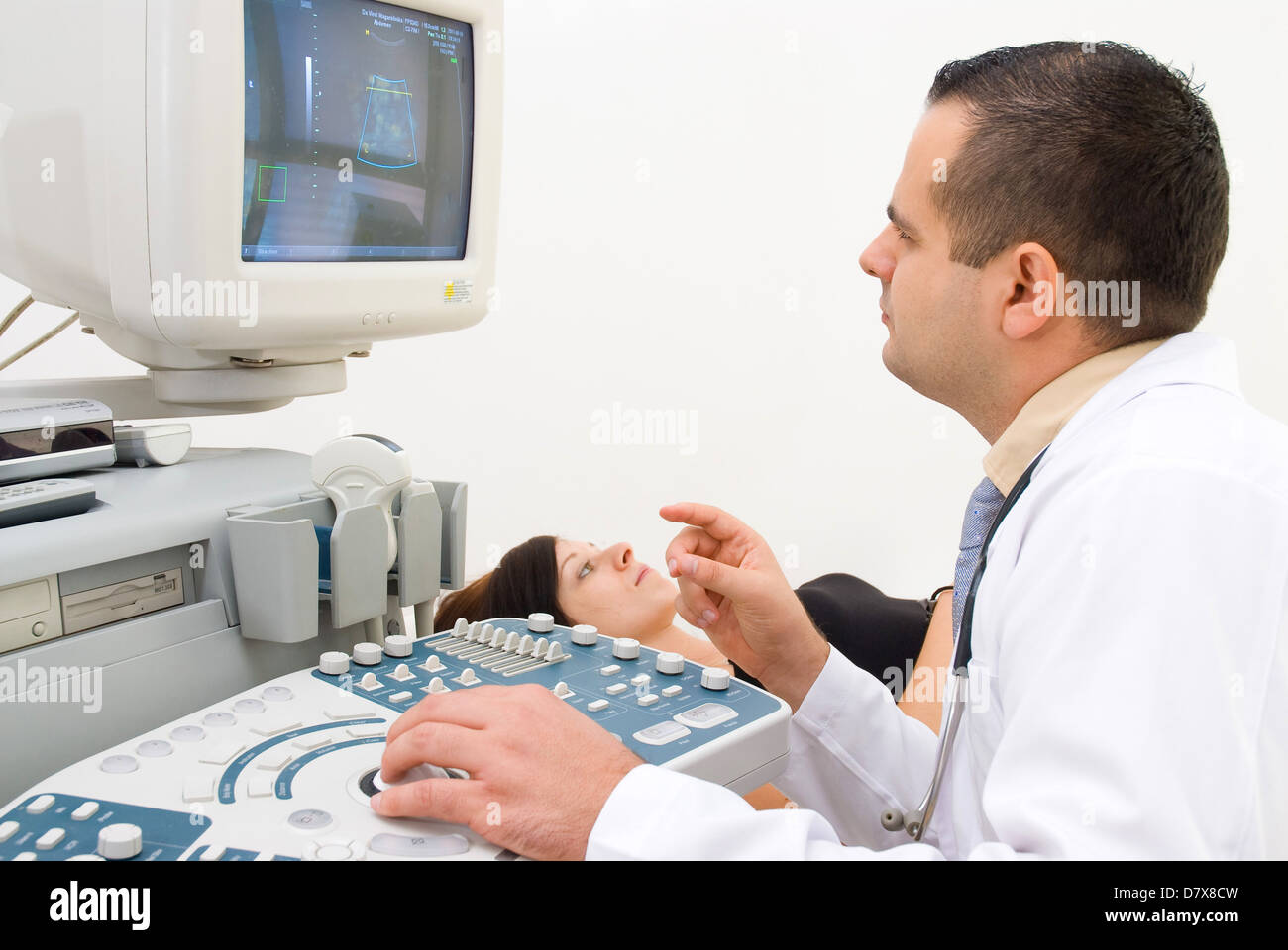 A doctor shows the patient on the monitor of the ultrasound image Stock ...
