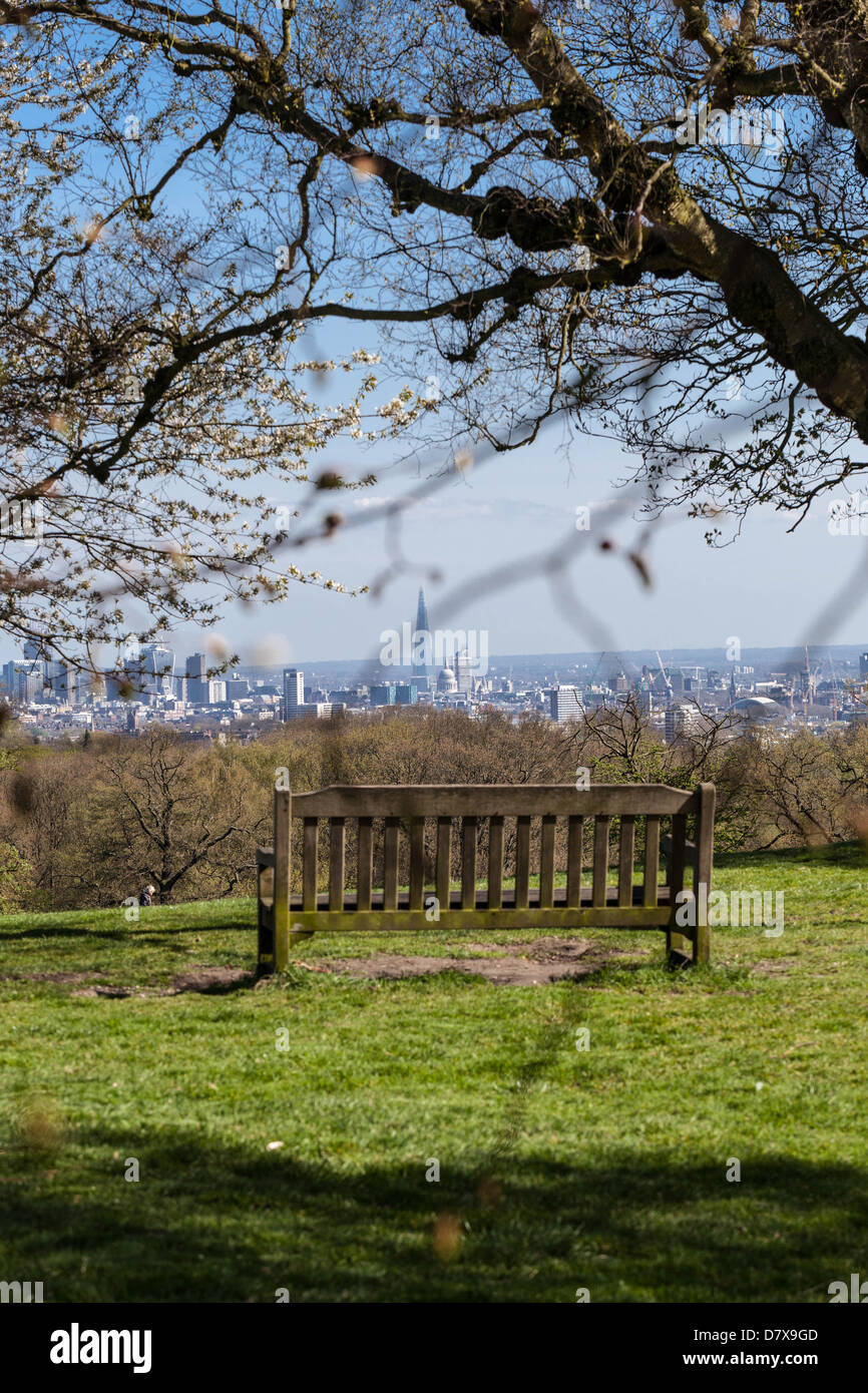 Empty bench at viewpoint of London skyline, Hampstead Heath, London ...