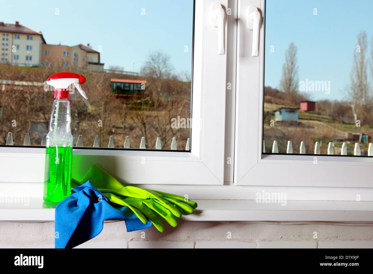 Cleaning window using tools - rag and spray detergent. Spring cleaning ...