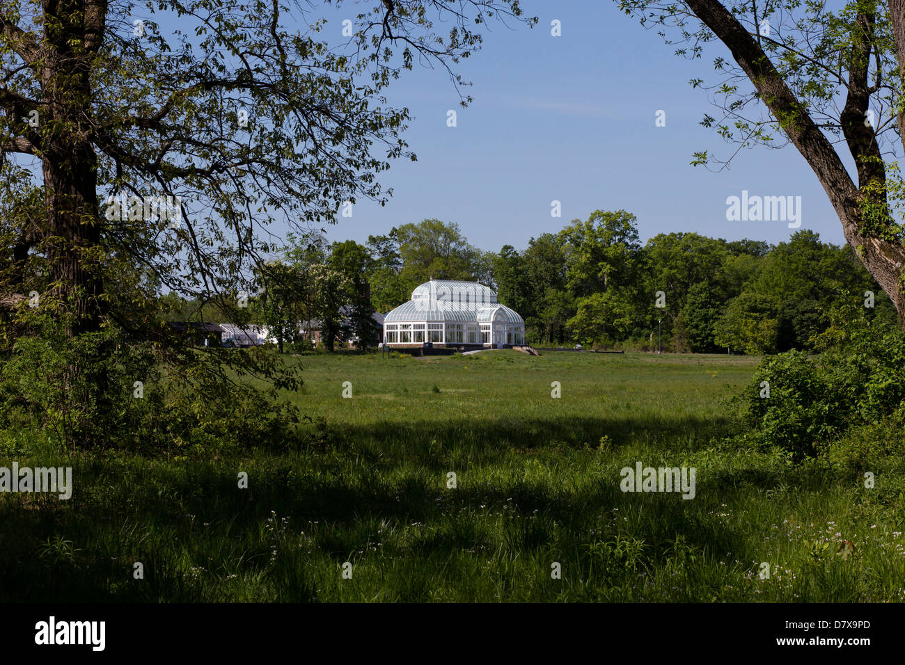 Victorian styled green house in a garden park setting Stock Photo - Alamy