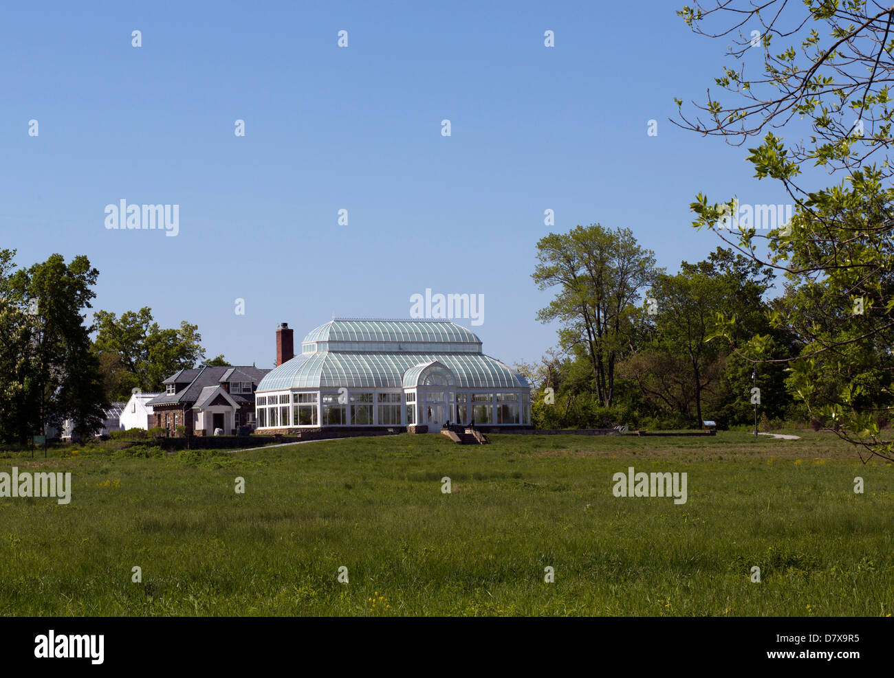 Victorian styled green house in a garden park setting Stock Photo - Alamy