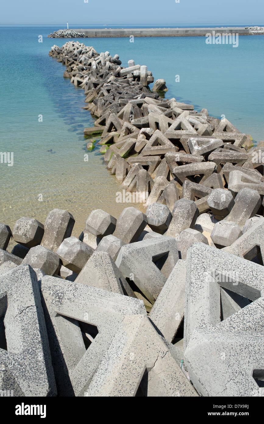 Breakwater with concrete blocks for protection of coast Stock Photo - Alamy